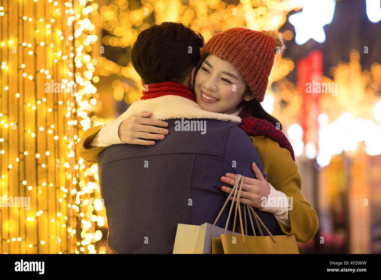 Happy couples hug Stock Photo - Alamy