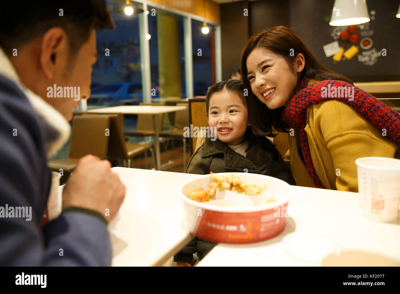 Happy family dining in a restaurant Stock Photo - Alamy