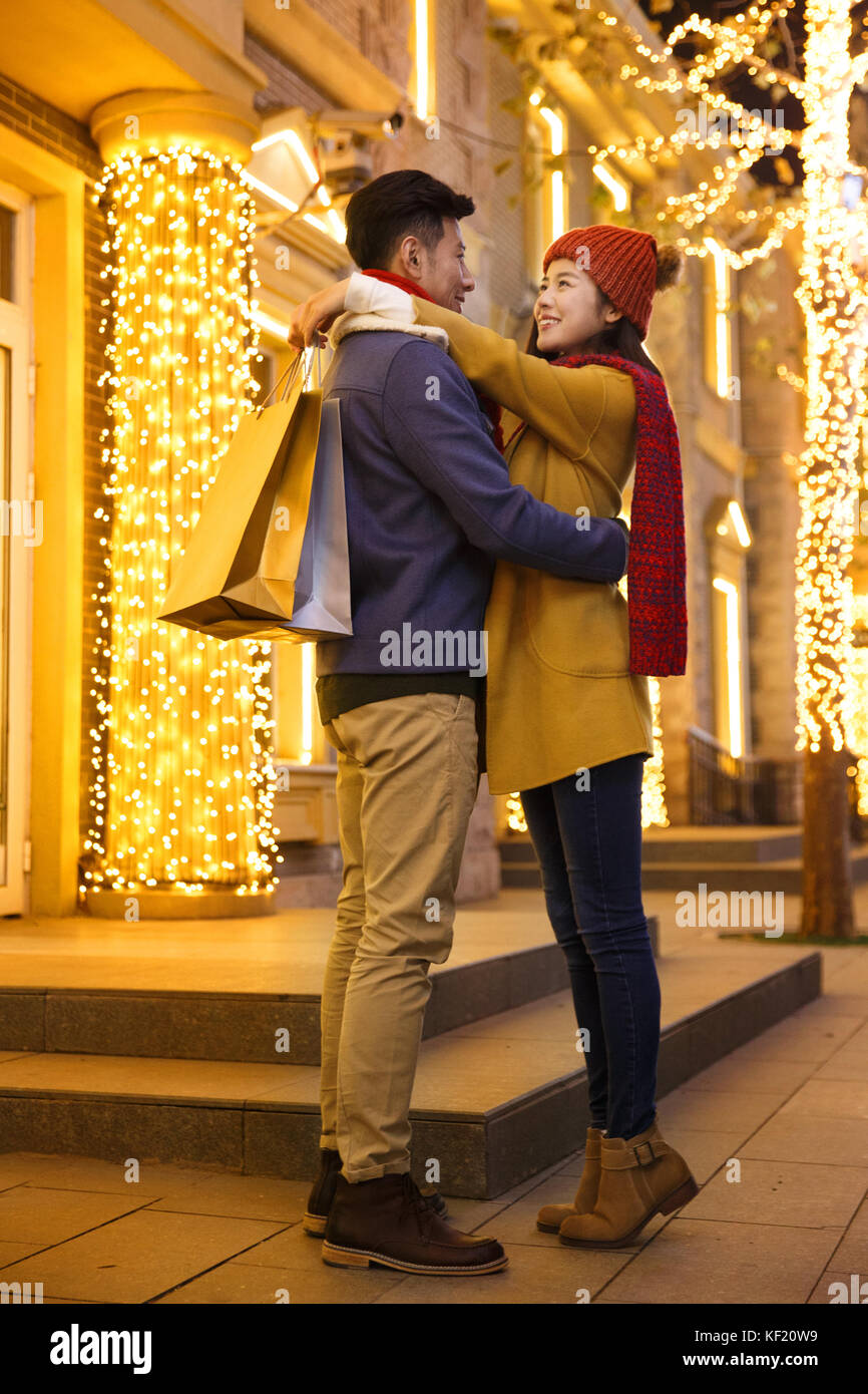 Happy couples hug Stock Photo - Alamy