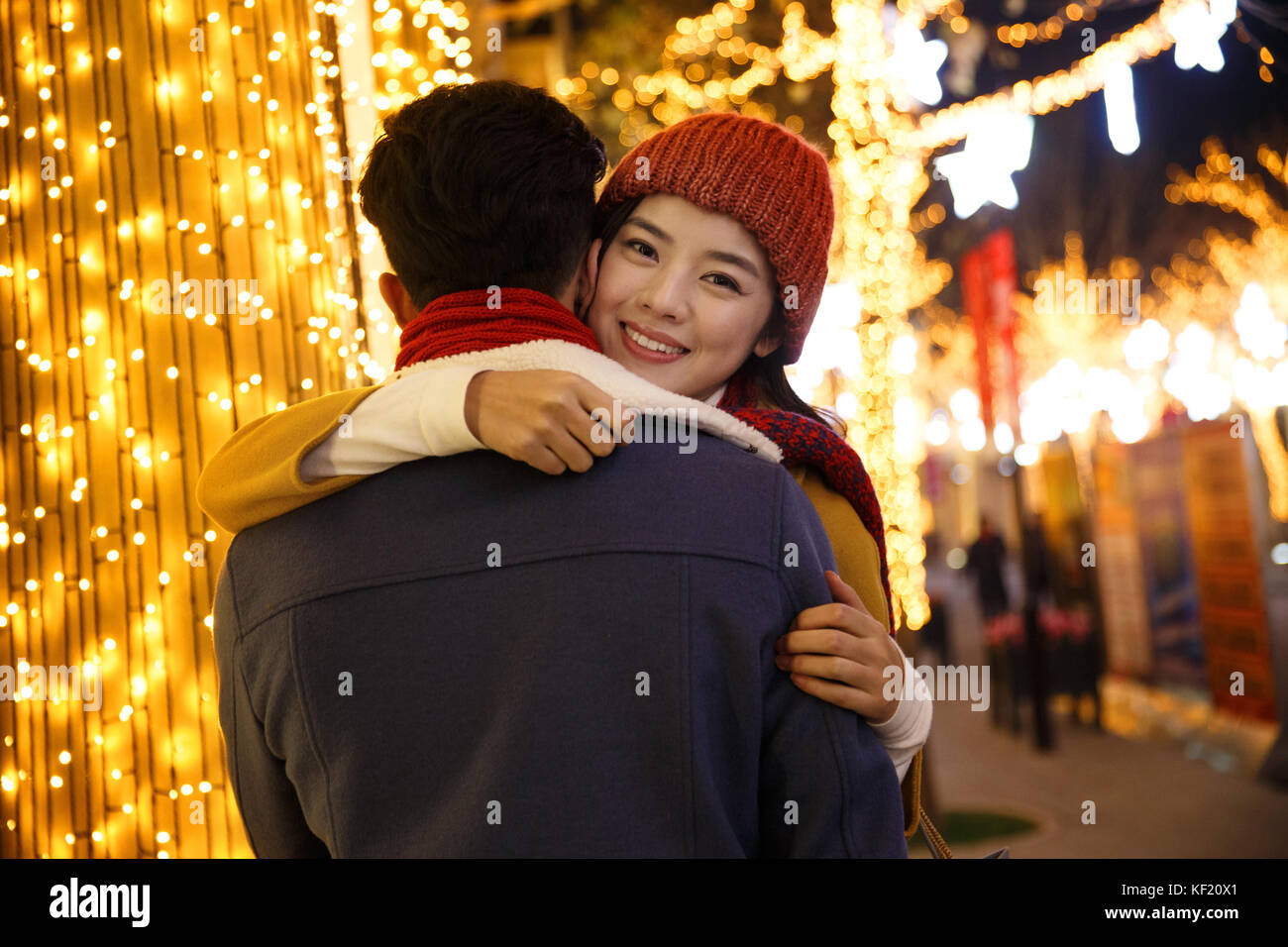 Happy couples hug Stock Photo - Alamy
