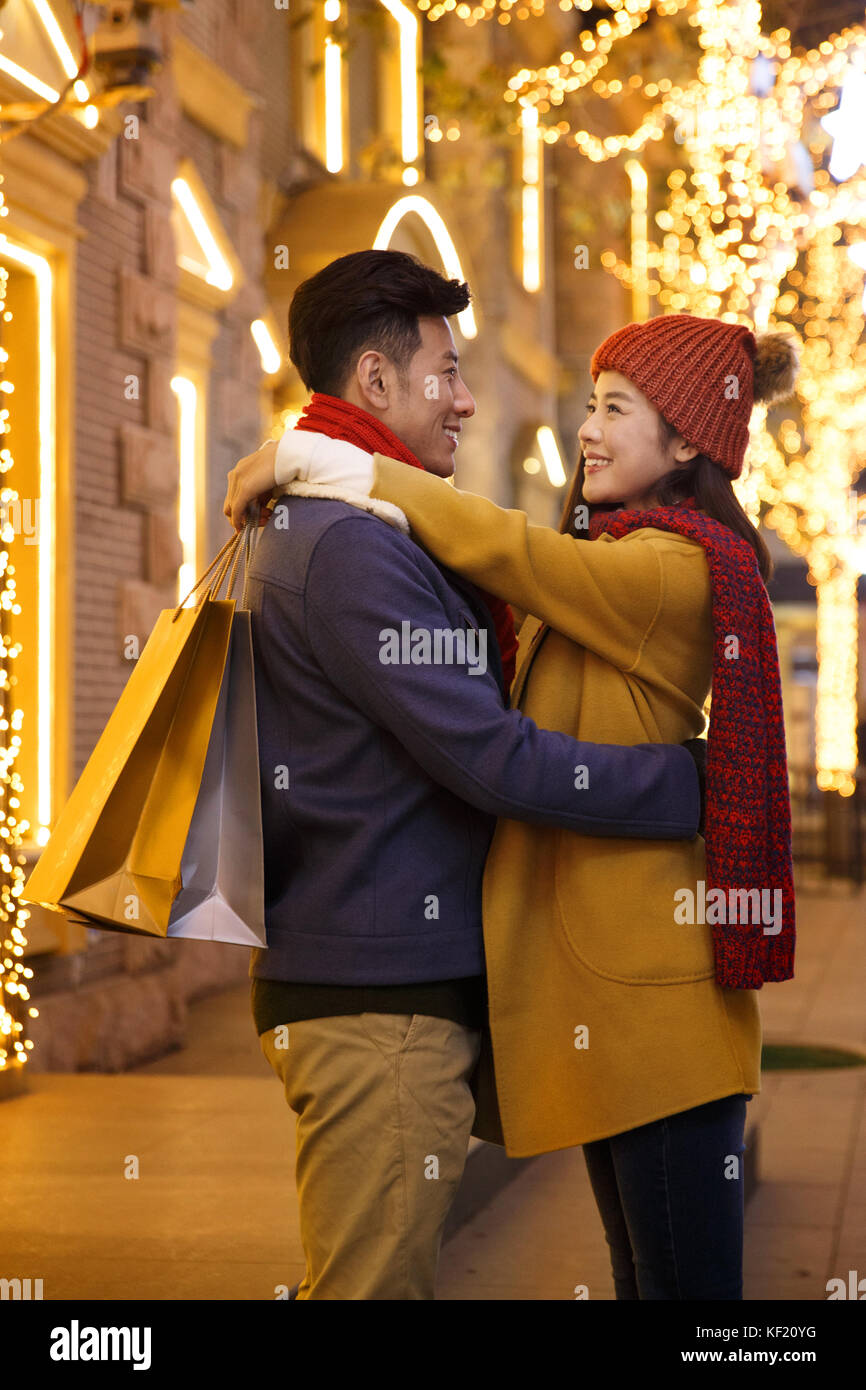 Happy couples hug Stock Photo - Alamy