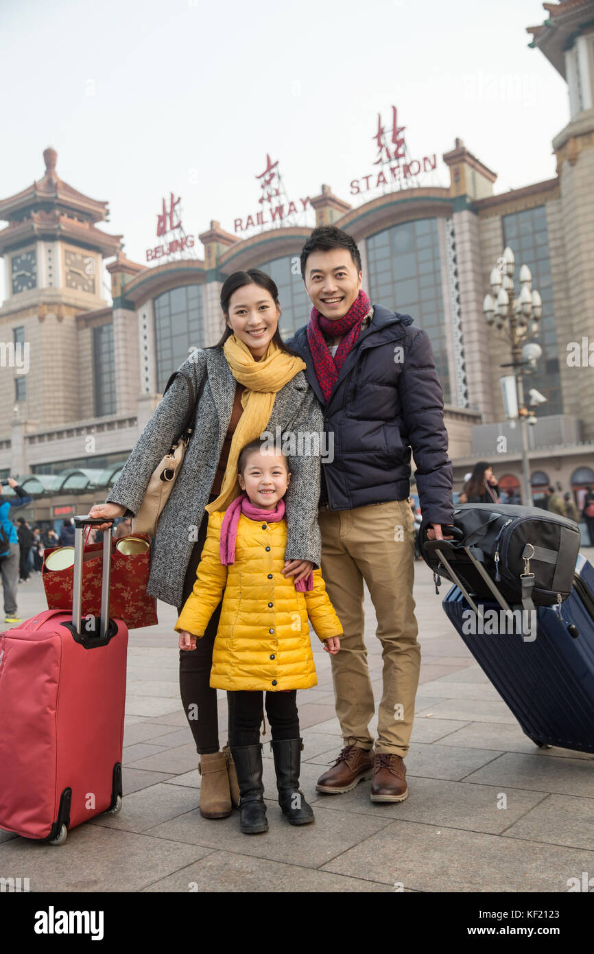 Happy family in front of the square Stock Photo - Alamy
