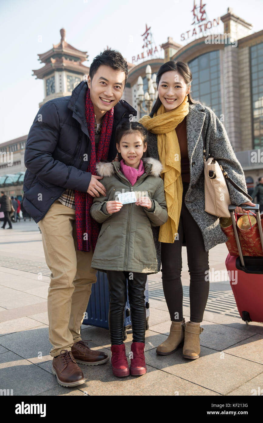 Happy family in front of the square Stock Photo - Alamy