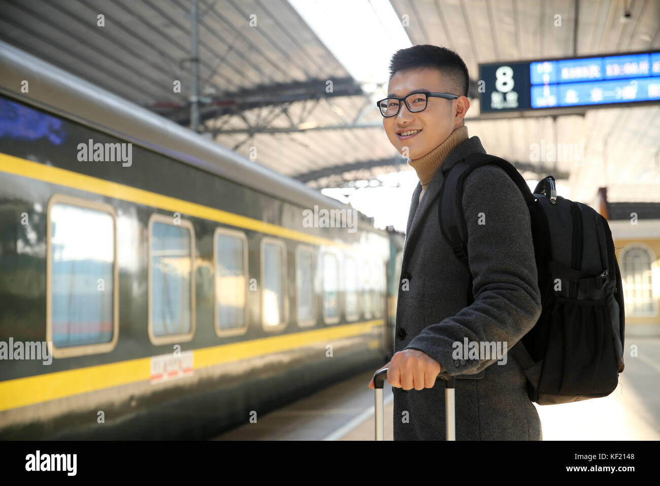 The young man at the station platform Stock Photo - Alamy