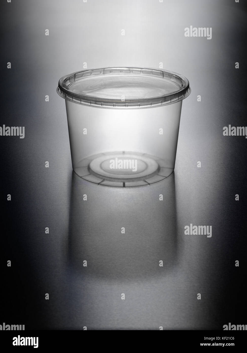 Light glowing through empty plastic food storage leftover container on ...