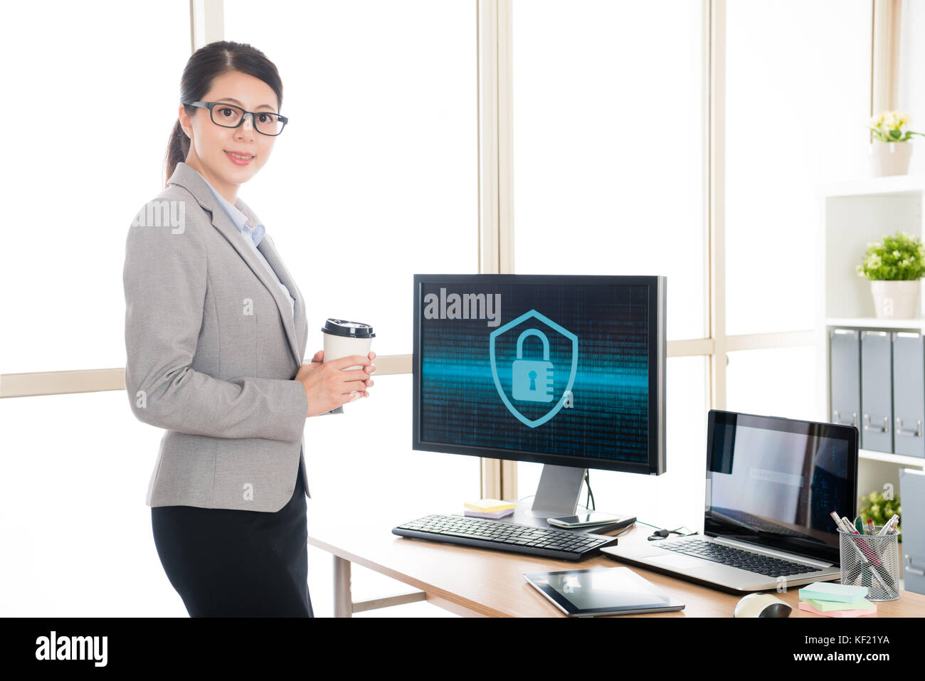 confident smiling woman office worker finished cyber security research ...