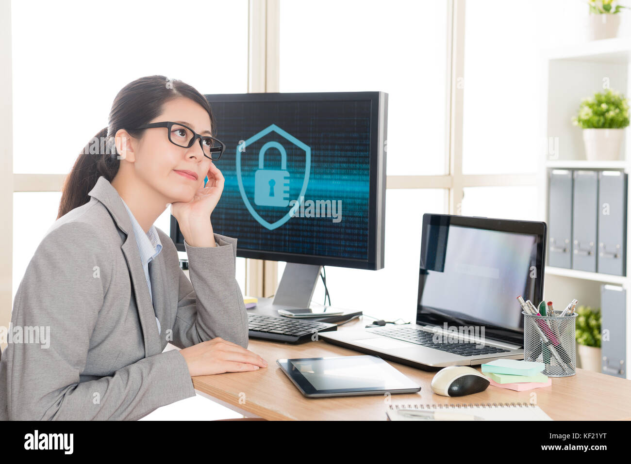 pretty young woman business worker thinking how to solve internet cyber ...
