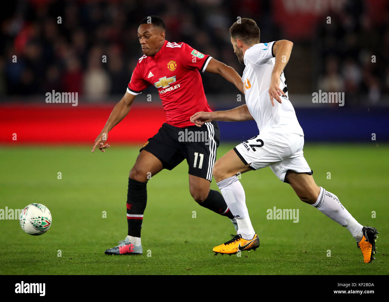 Manchester United's Anthony Martial (left) and Swansea City's Angel ...