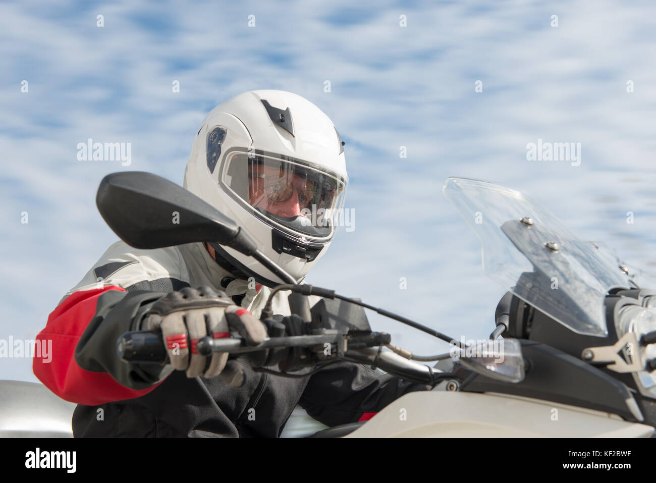 a portrait of a senior biker on his motorcycle Stock Photo - Alamy