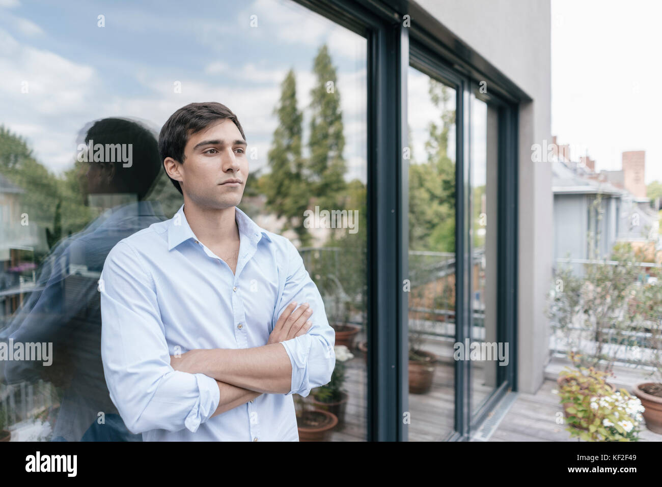 Man on balcony and sad hi-res stock photography and images - Alamy