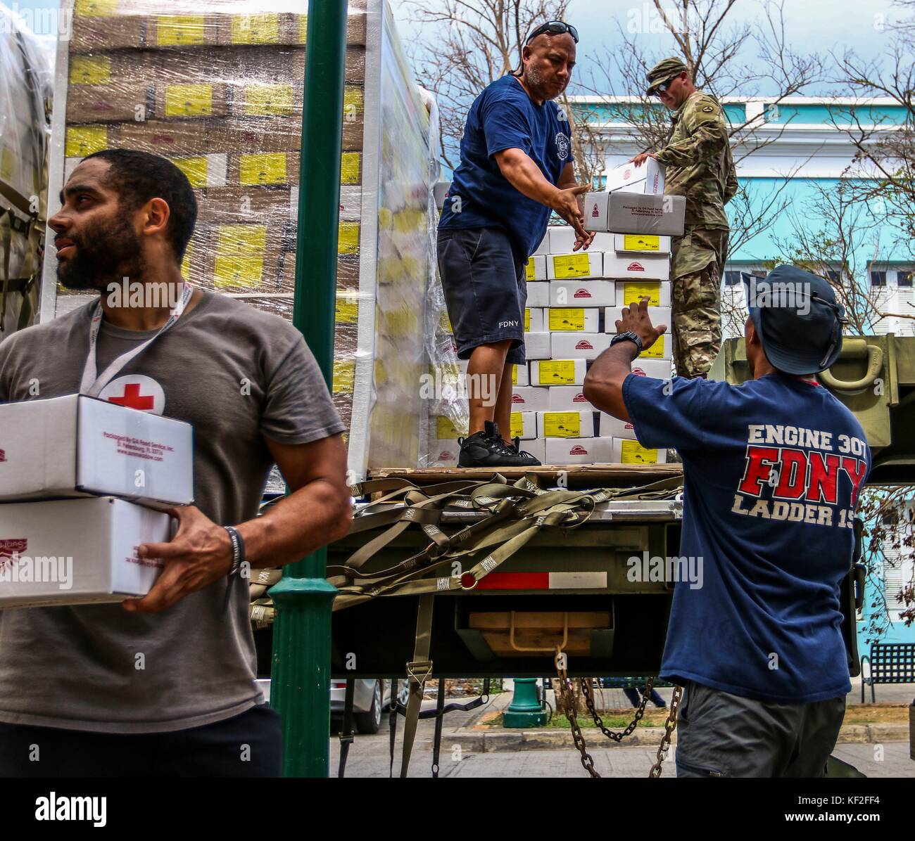 U.S. soldiers, firefighters and Red Cross volunteers deliver emergency ...