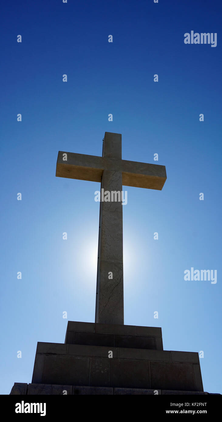 christian symbol against the sun with blue sky Stock Photo - Alamy