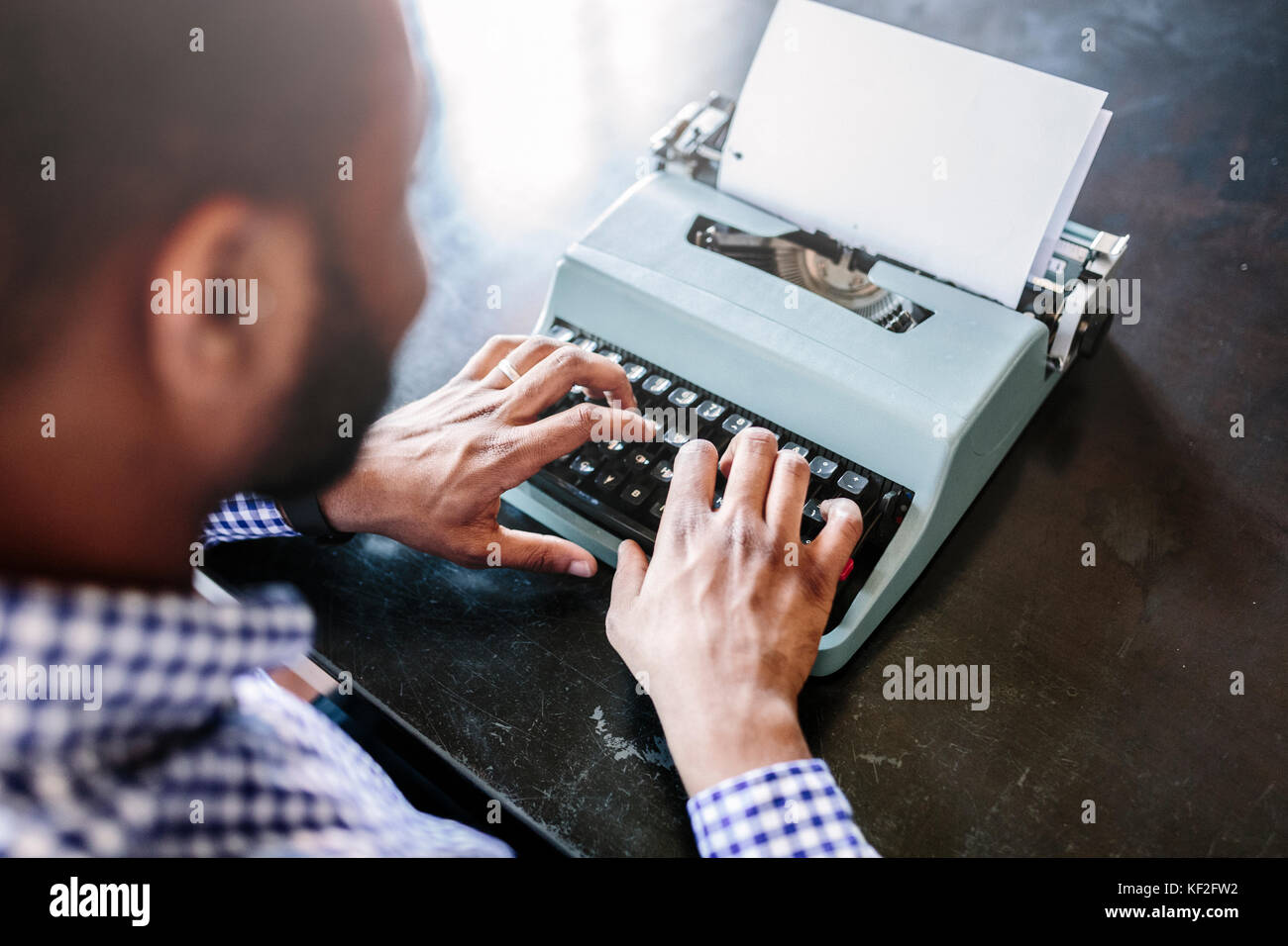 Man working at typewriter hi-res stock photography and images - Alamy