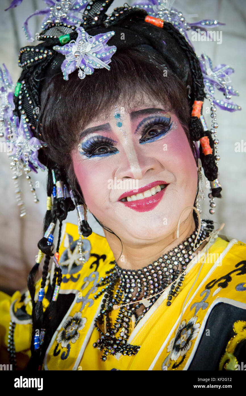 Portrait of a Chinese opera performer backstage before her performance ...