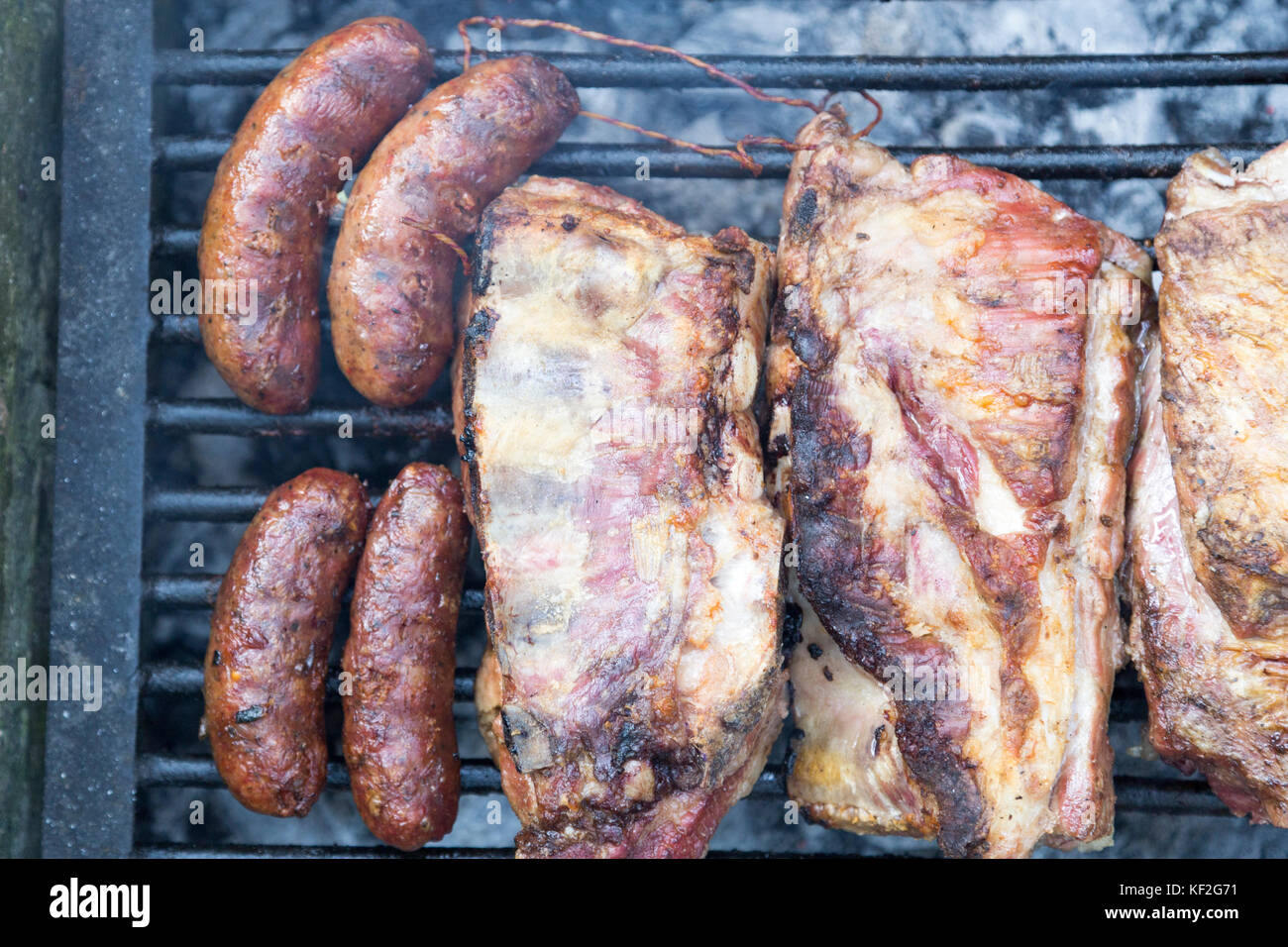 Cooking meat on the grill Stock Photo - Alamy