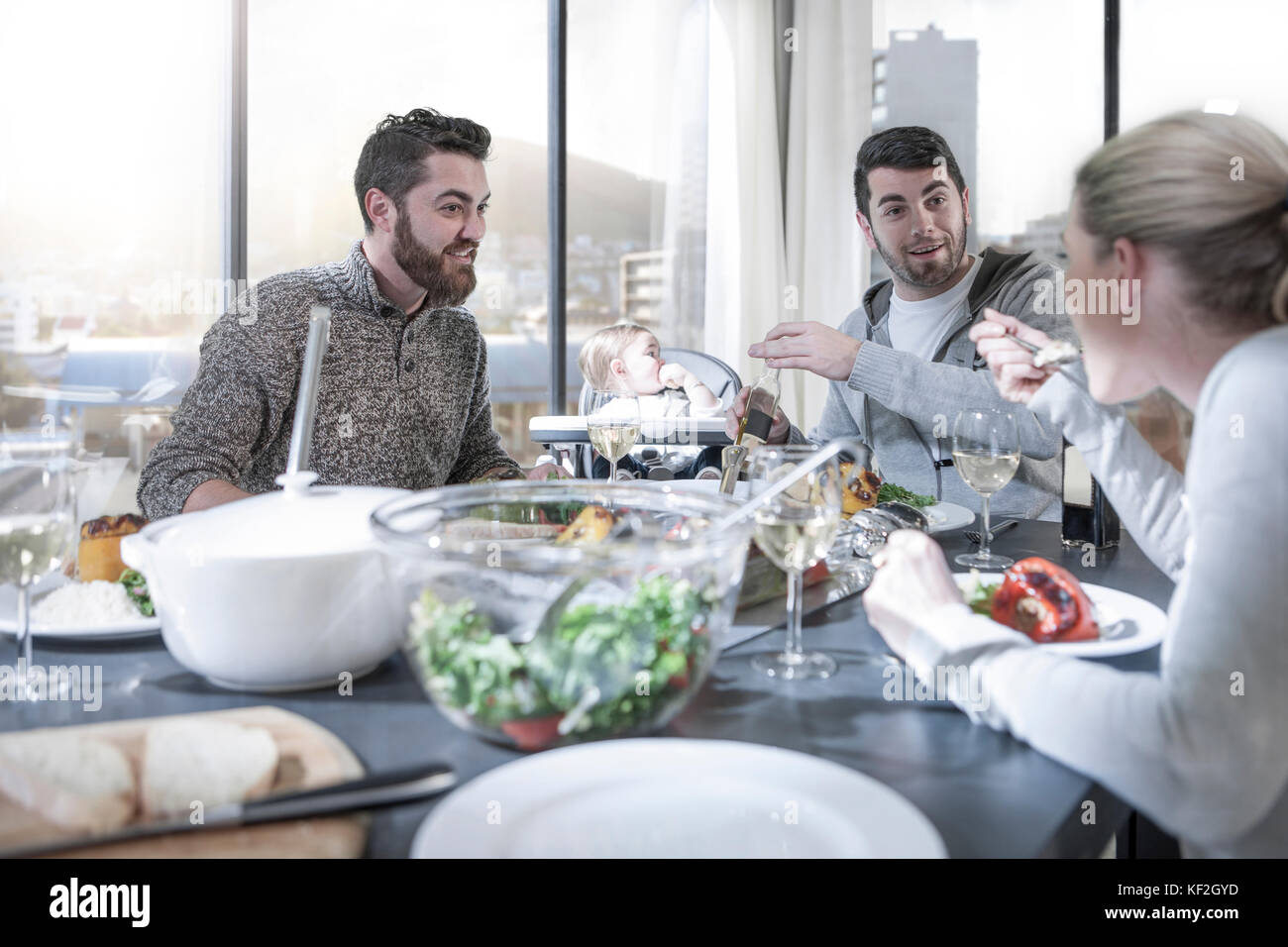 Family and friends having dinner together Stock Photo - Alamy