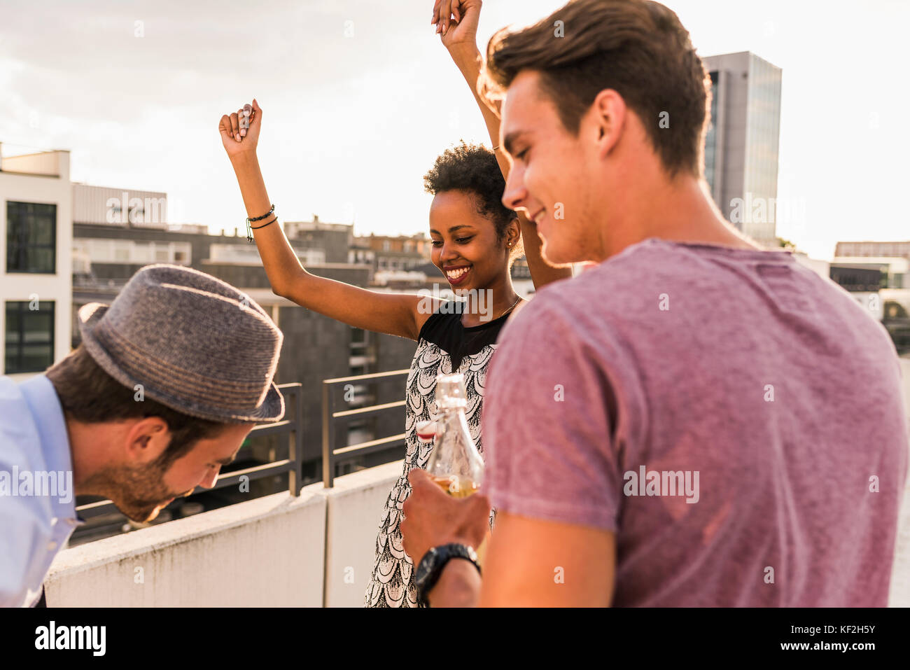 Friends having a rooftop party Stock Photo - Alamy