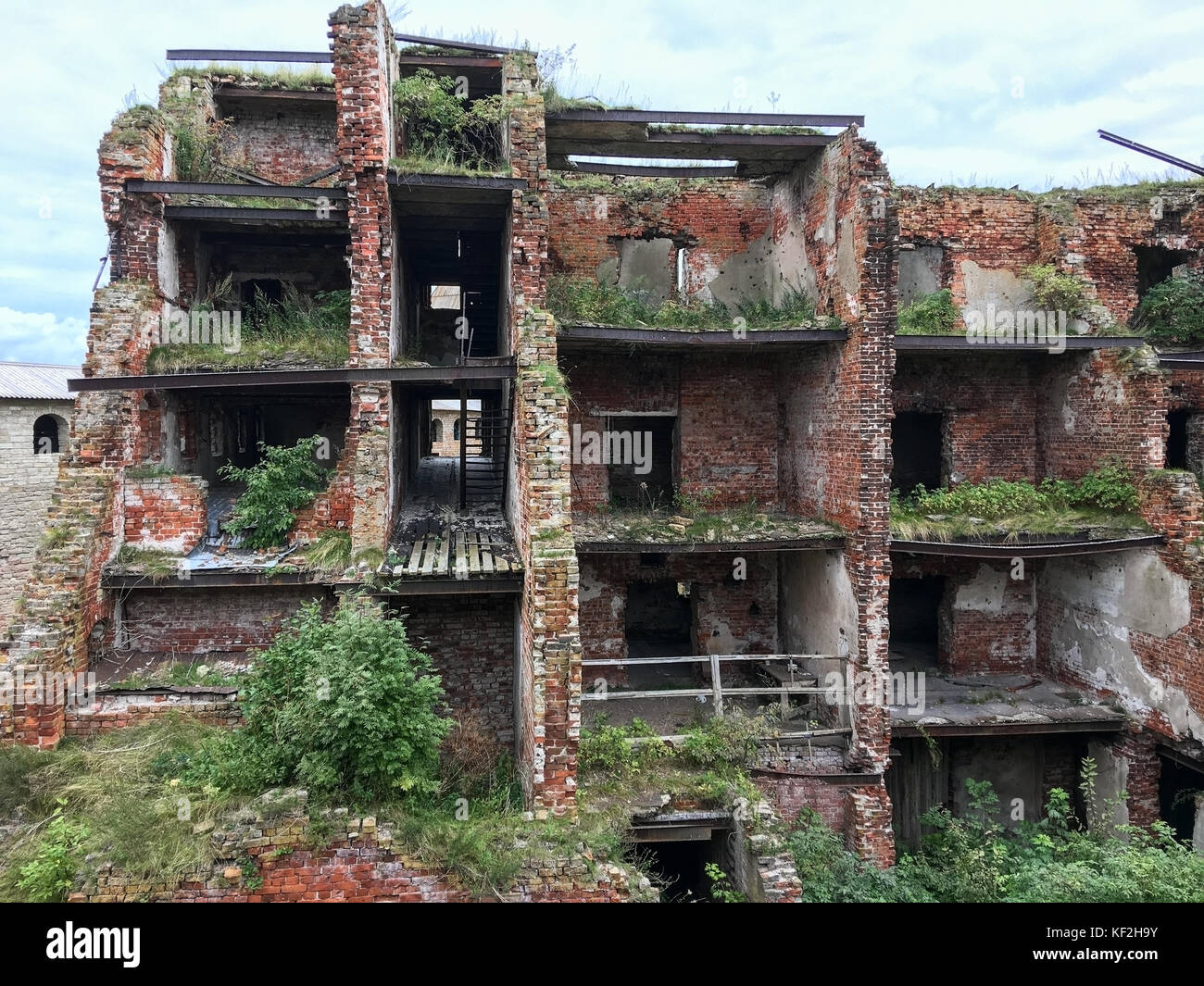 Ruins of demolished red brick building. Floors with damaged rooms Stock ...