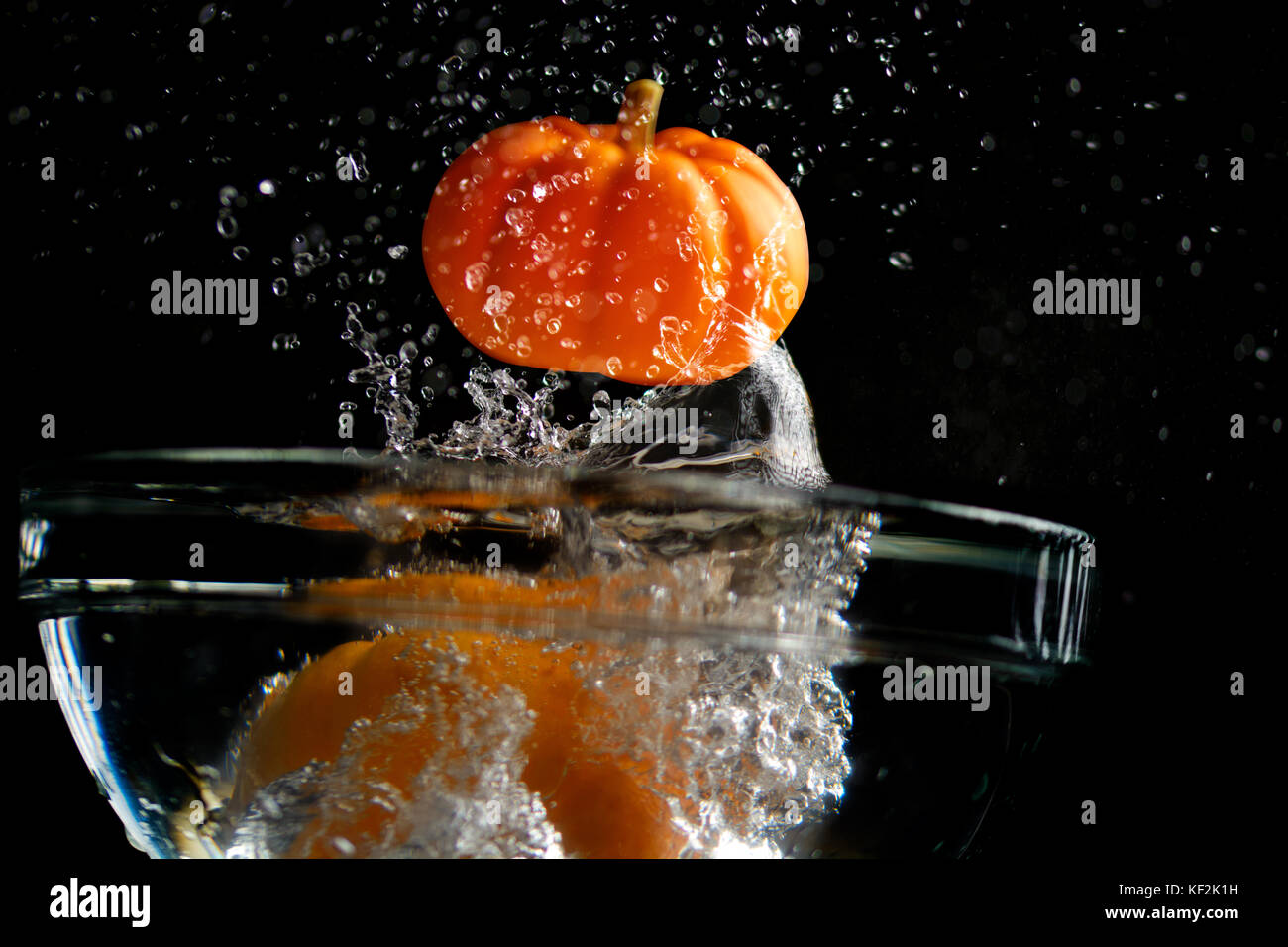 water splash, pumpkin falling in water and making a splash Stock Photo ...