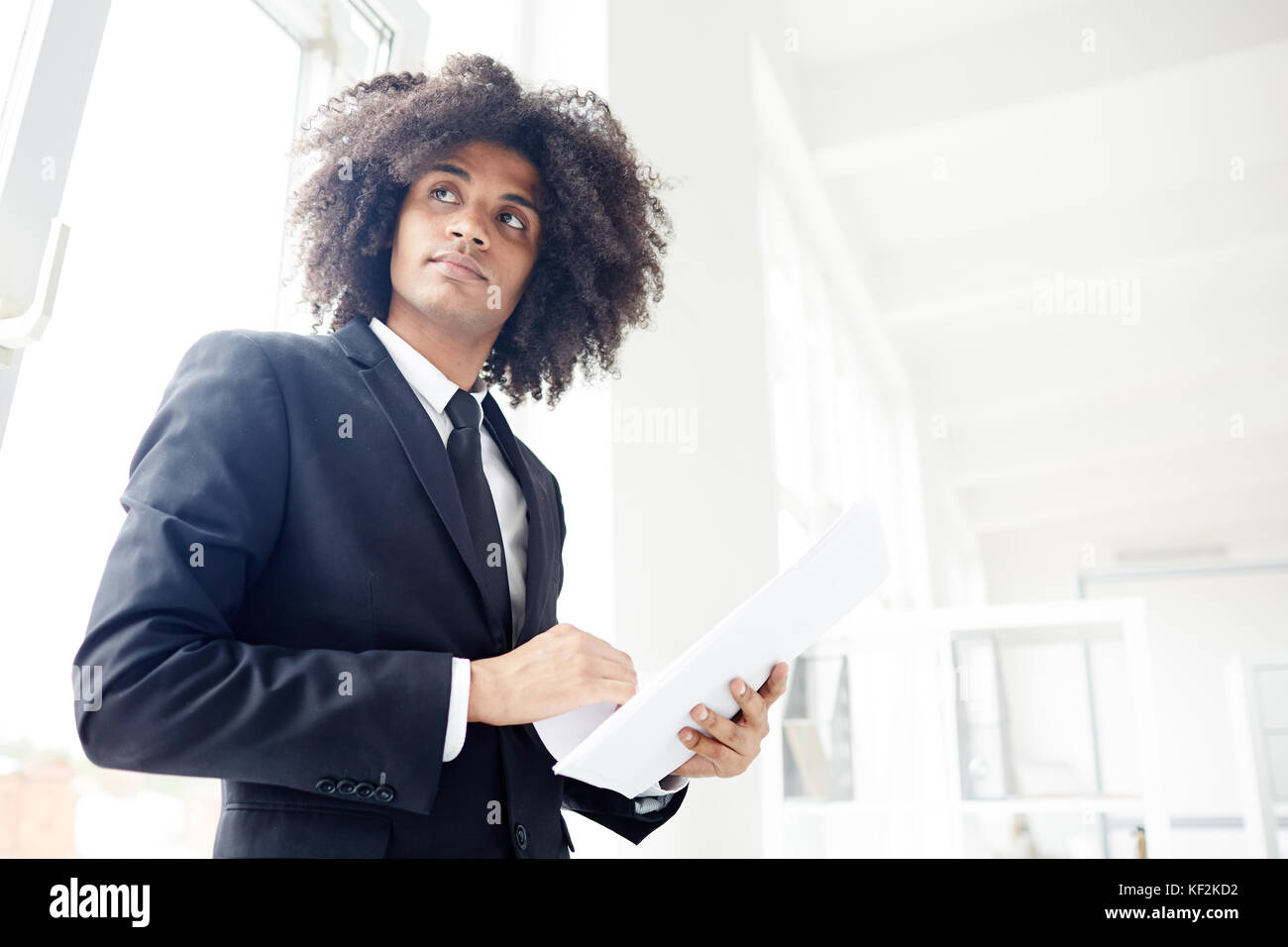 Man with papers Stock Photo - Alamy