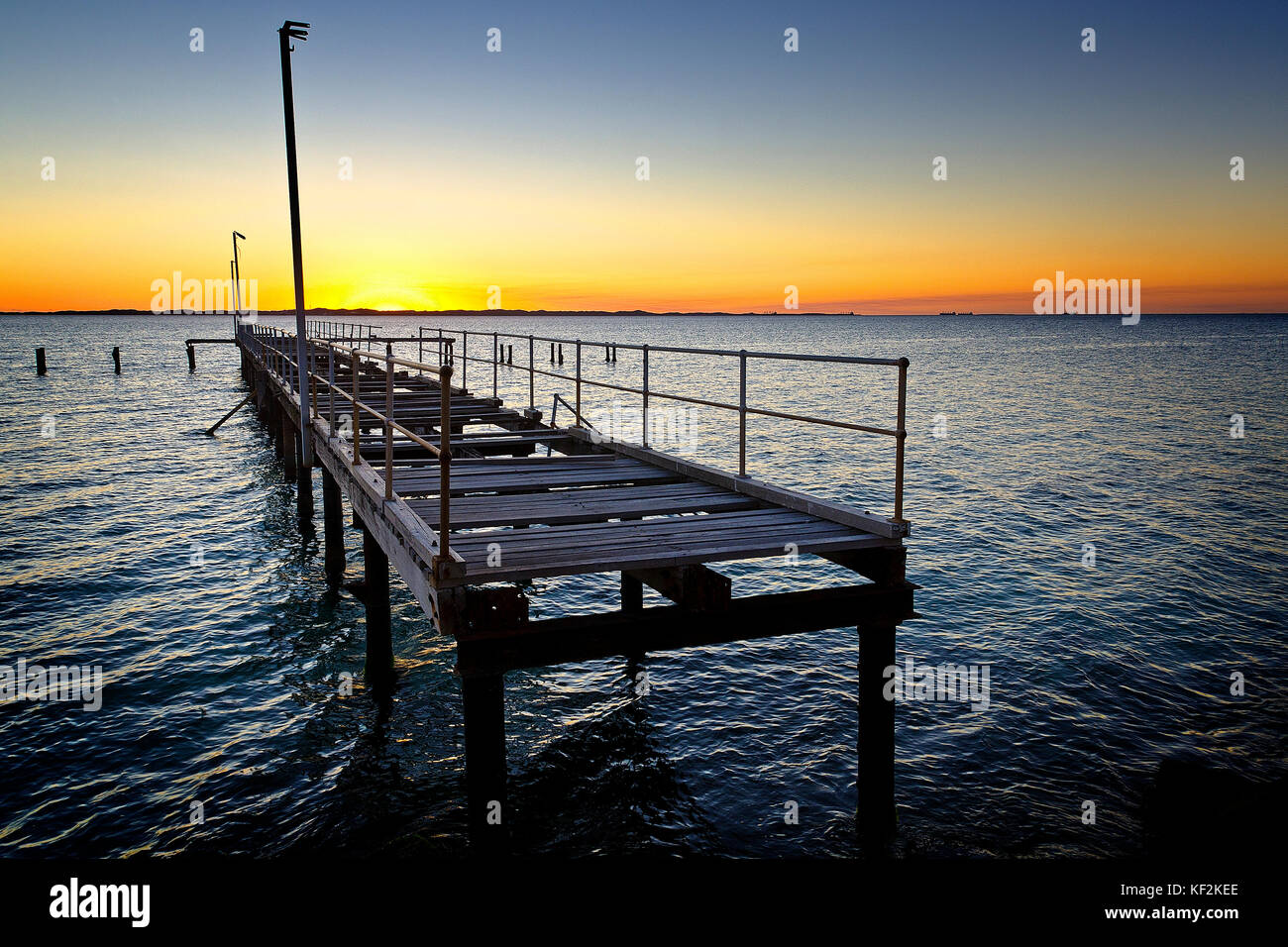 Old wooden jetty destroyed in storm at sunset, Rockingham, Western ...