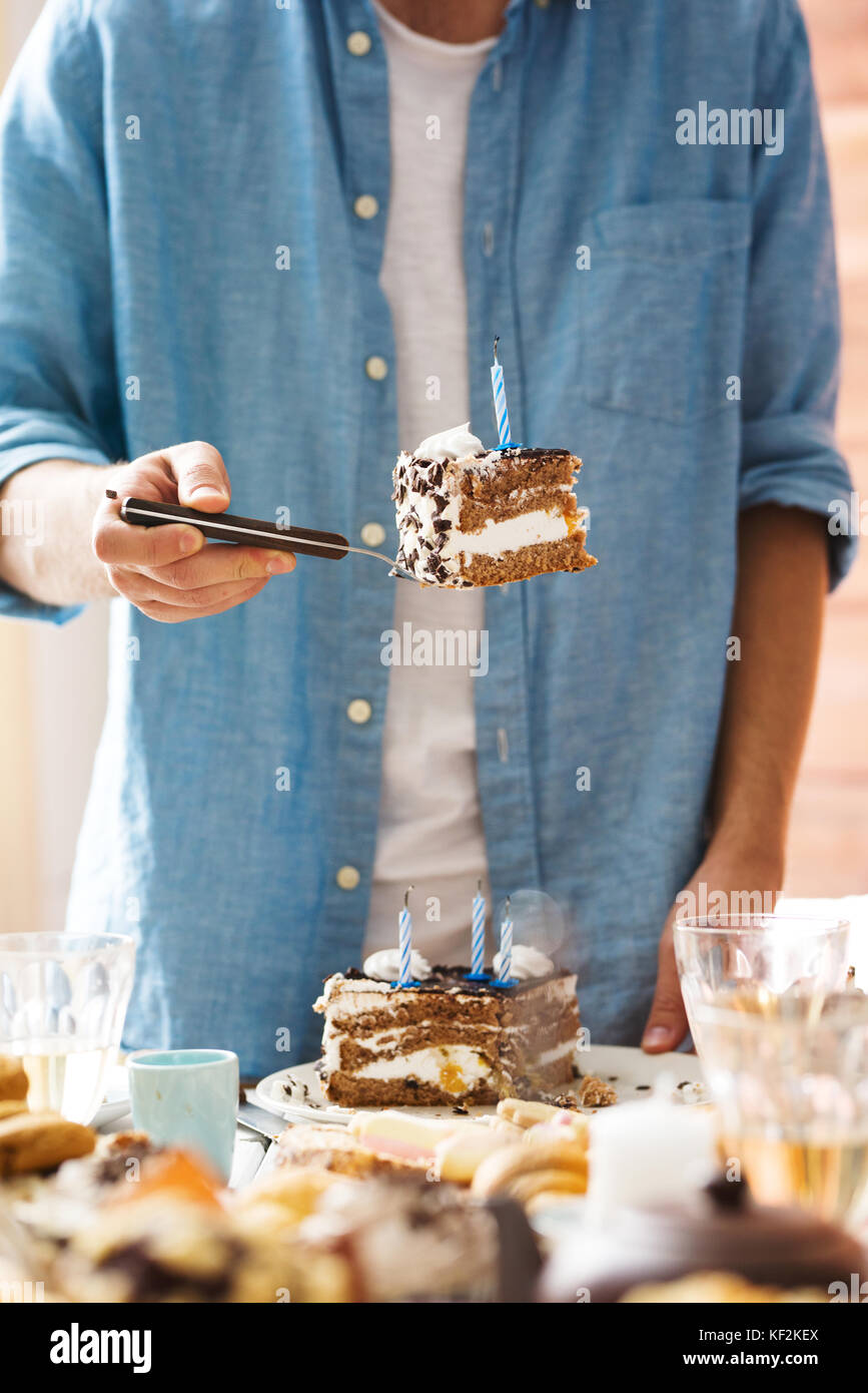 Sharing piece of cake Stock Photo - Alamy