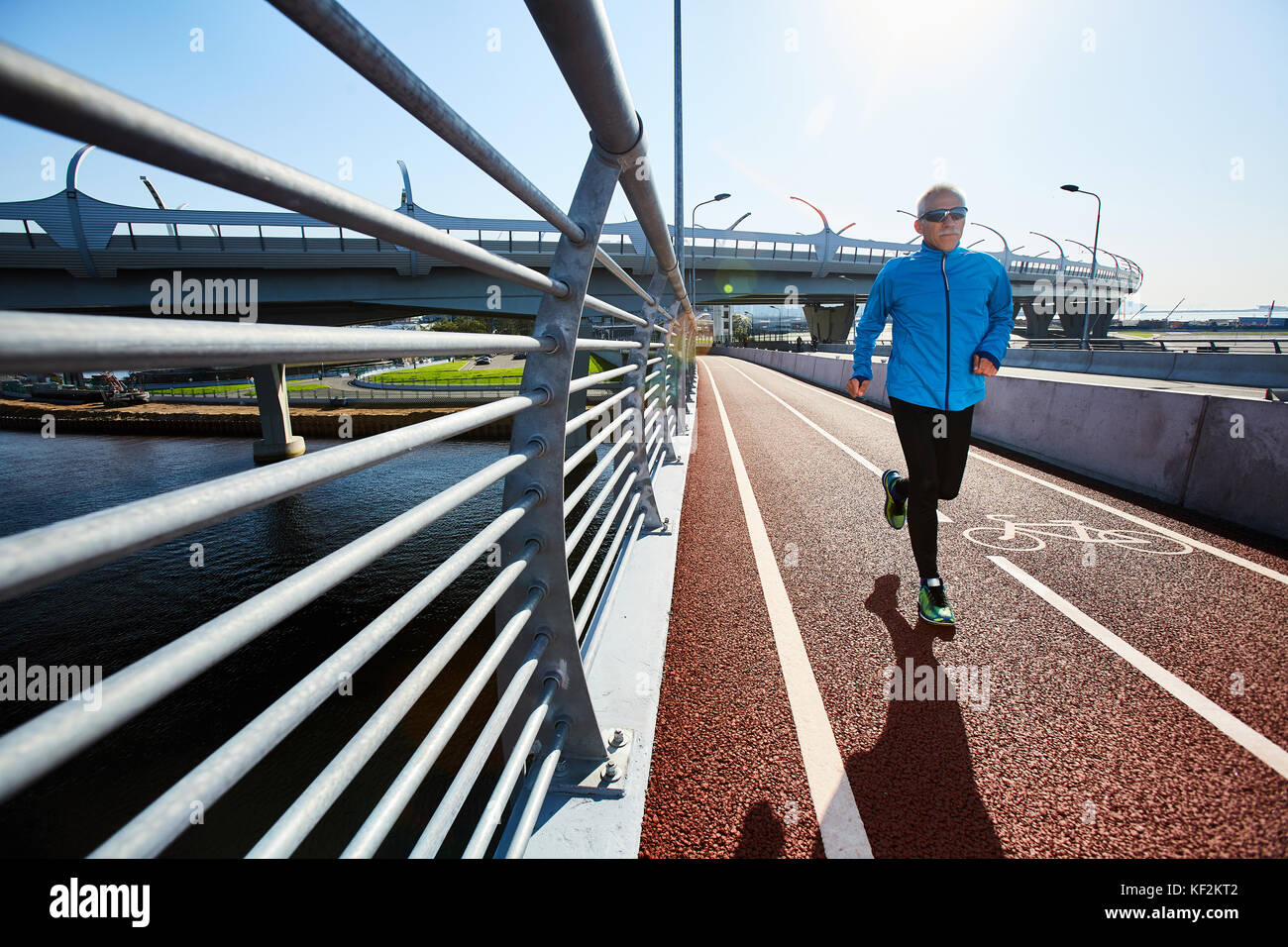 Running Along Athletic Track Stock Photo - Alamy
