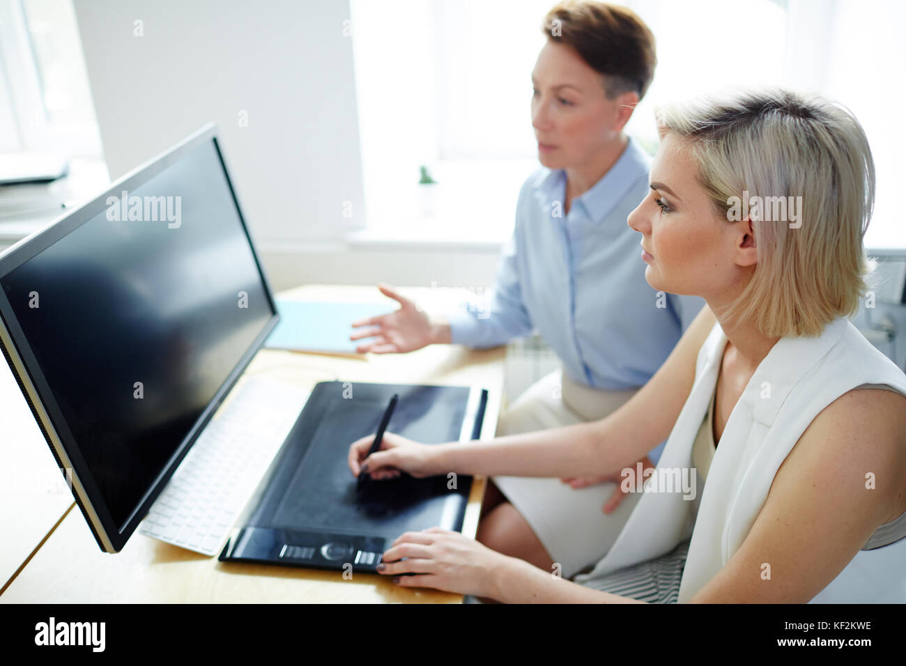 Talking during work Stock Photo - Alamy