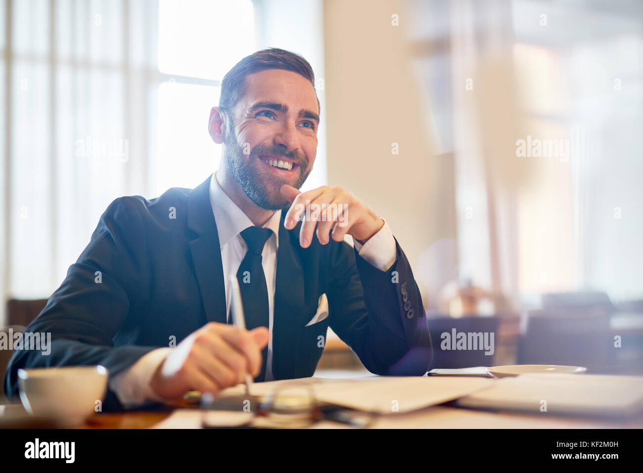 Cheerful Entrepreneur at Workplace Stock Photo - Alamy