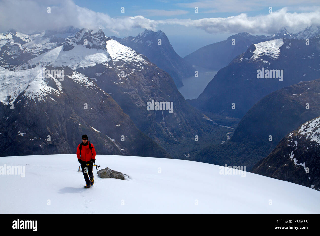Climber on Barrier Knob, looking to Milford Sound Stock Photo - Alamy