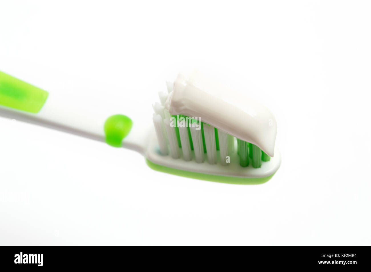 Green Toothbrush on a white background Stock Photo - Alamy
