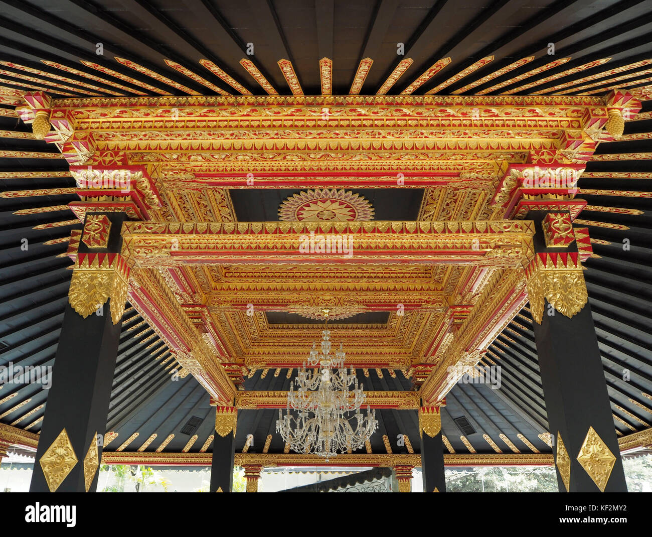 Glass chandelier and golden wood structure at the Kraton in Jogjakarta ...