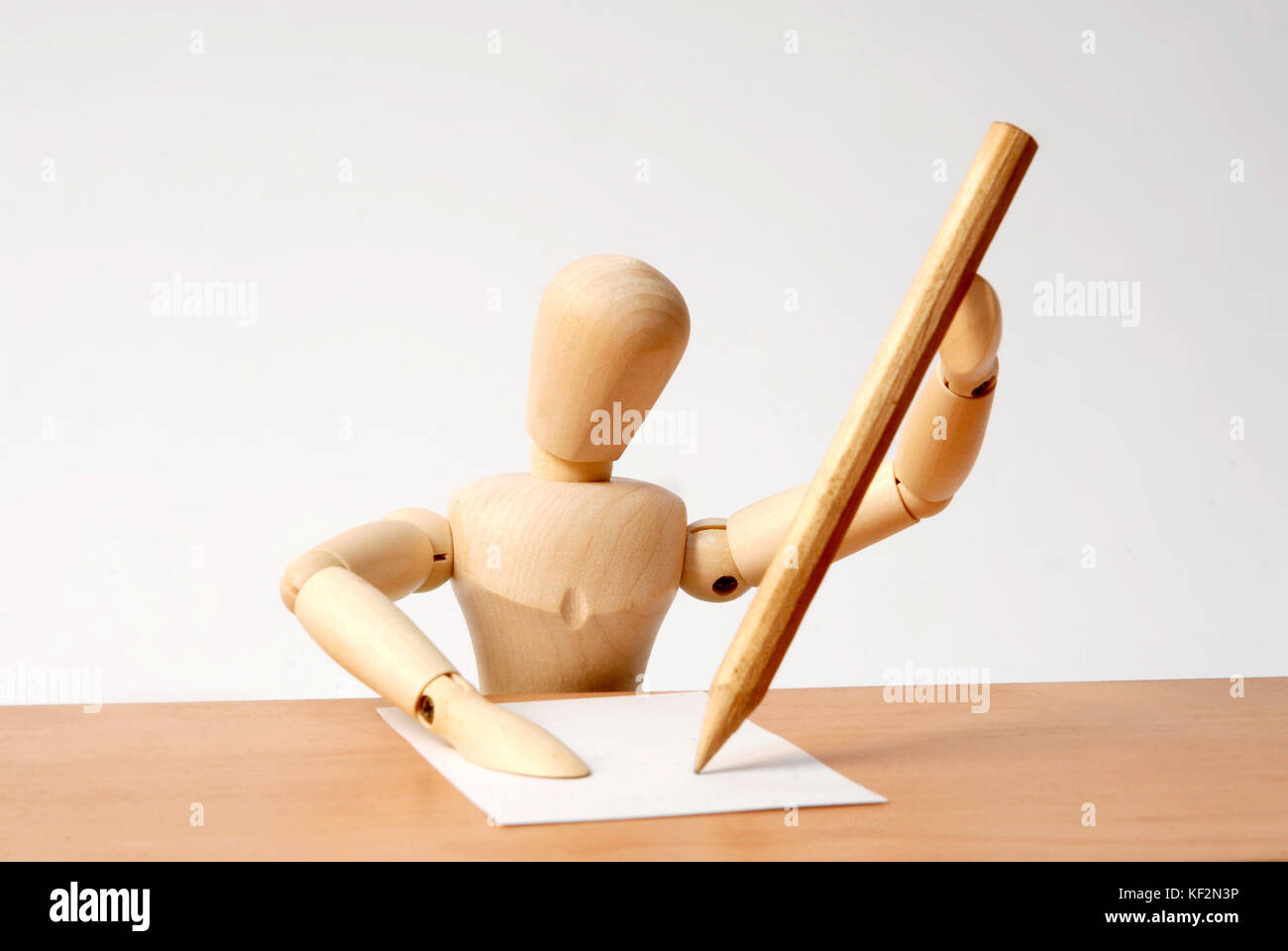 Dummy sitting behind the desk Stock Photo - Alamy
