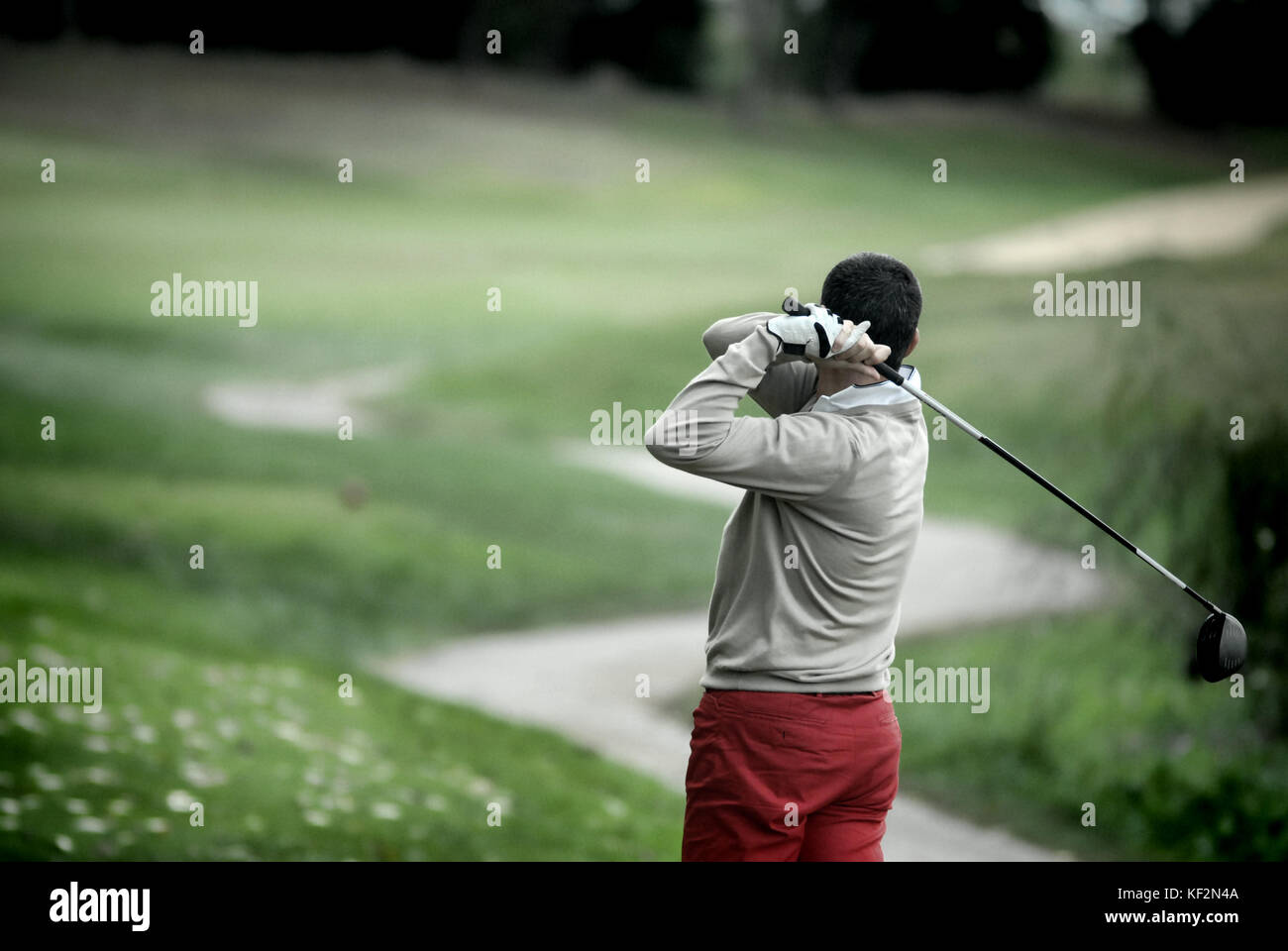 golfer shooting a golf ball Stock Photo - Alamy