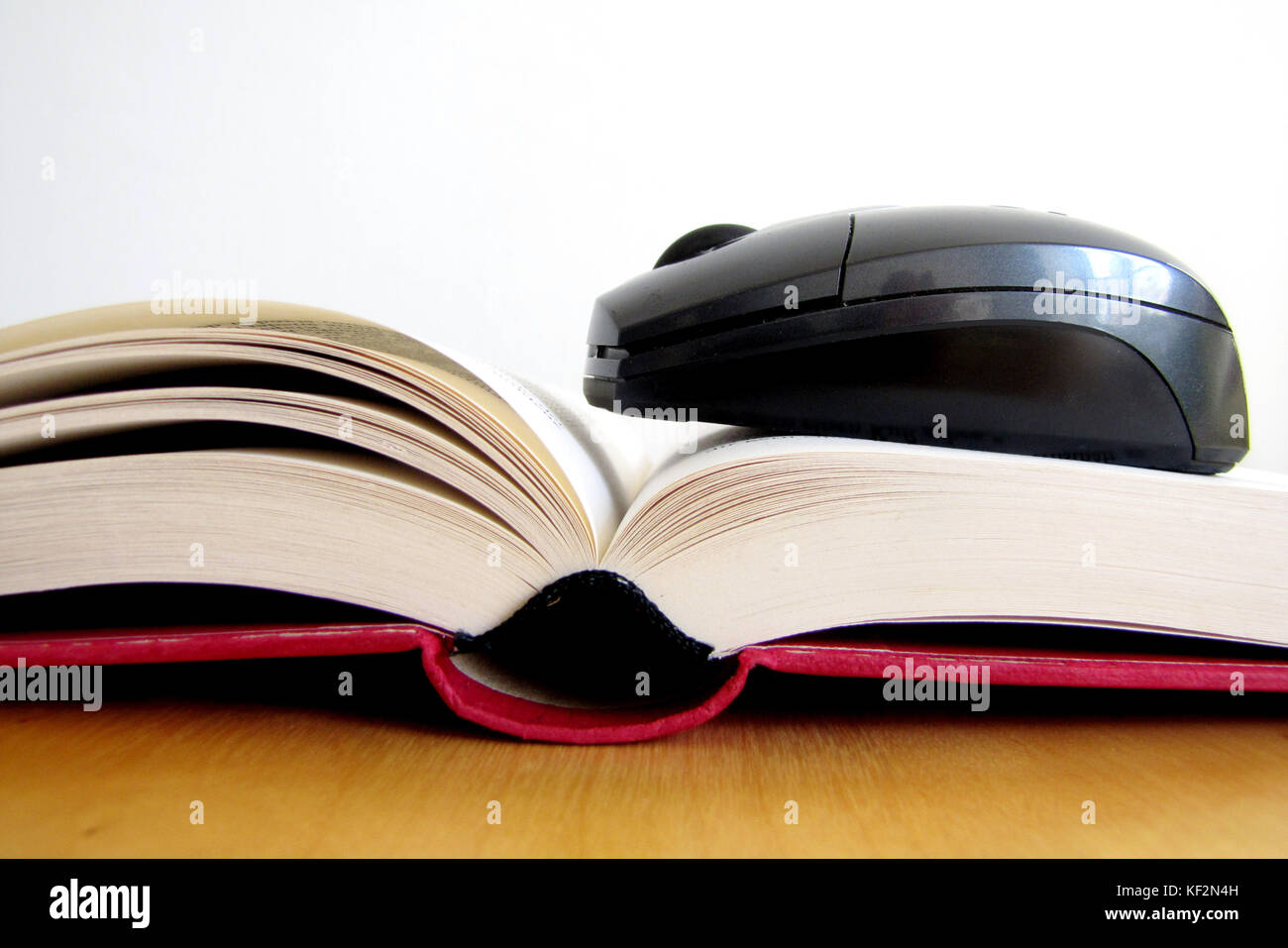 Concept of ebook. Book and mouse Stock Photo - Alamy