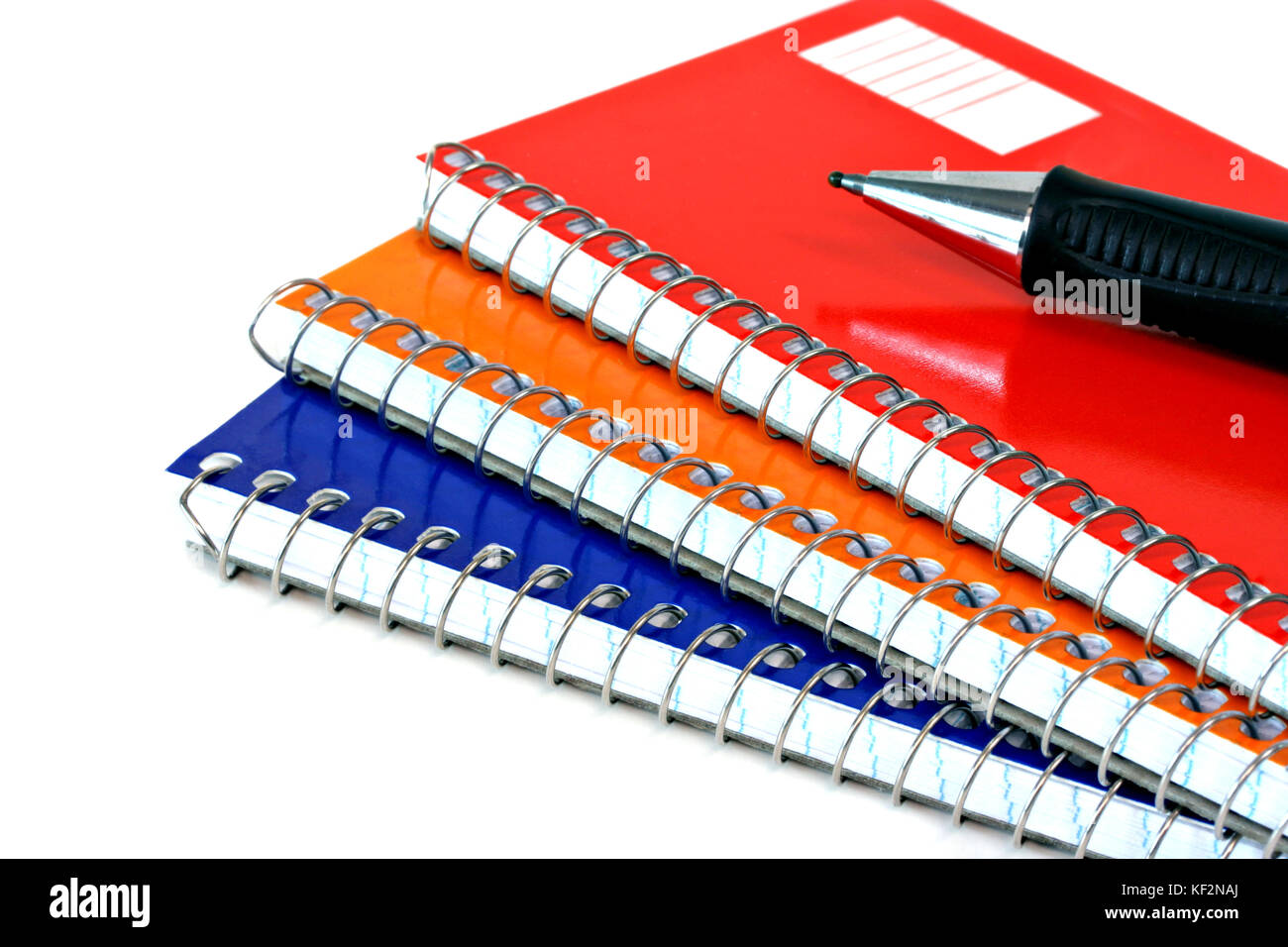 Three partial spiral notebooks on white with copy space Stock Photo - Alamy