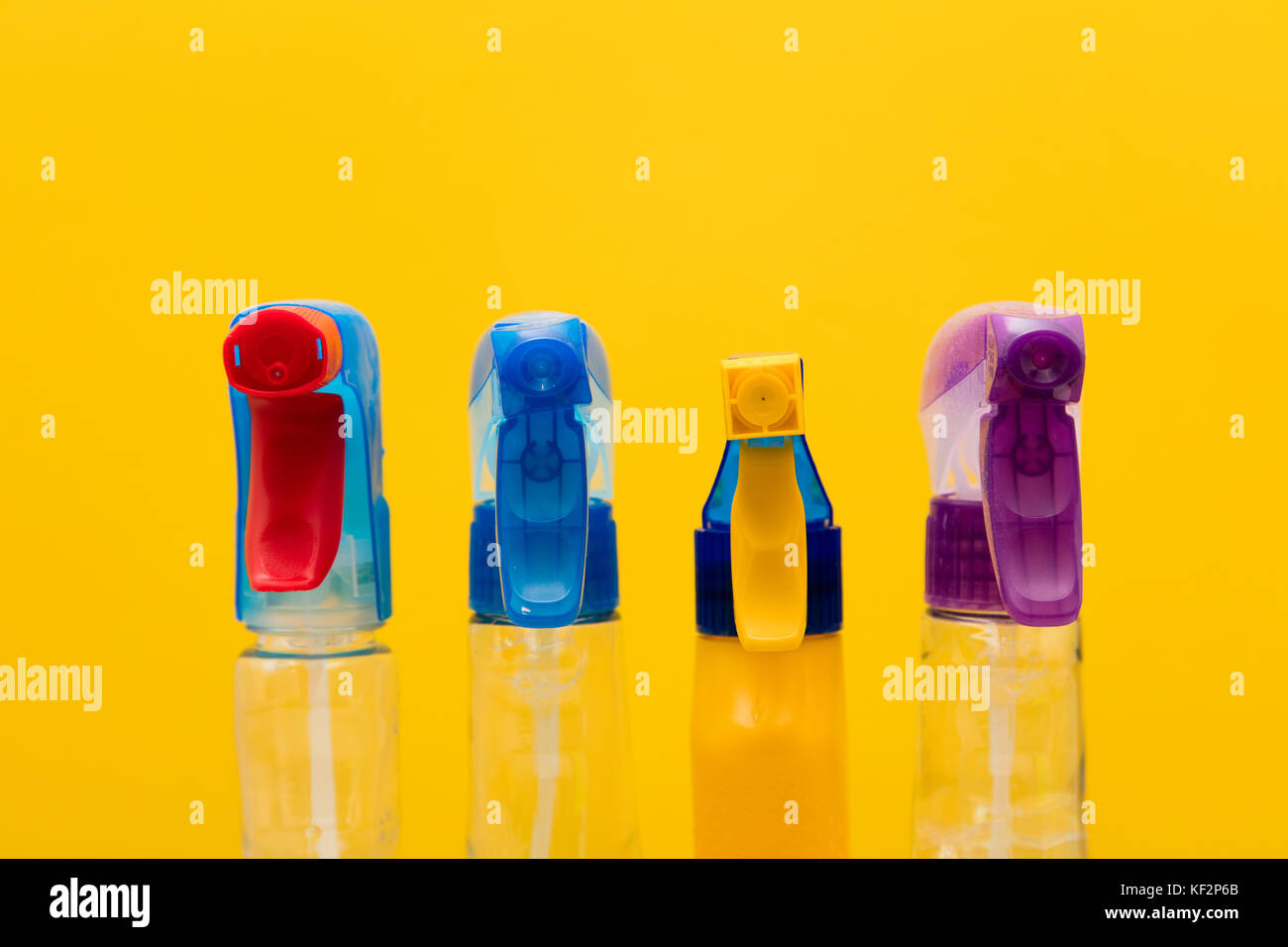 Cleaning spray bottle products on a bright yellow background Stock ...