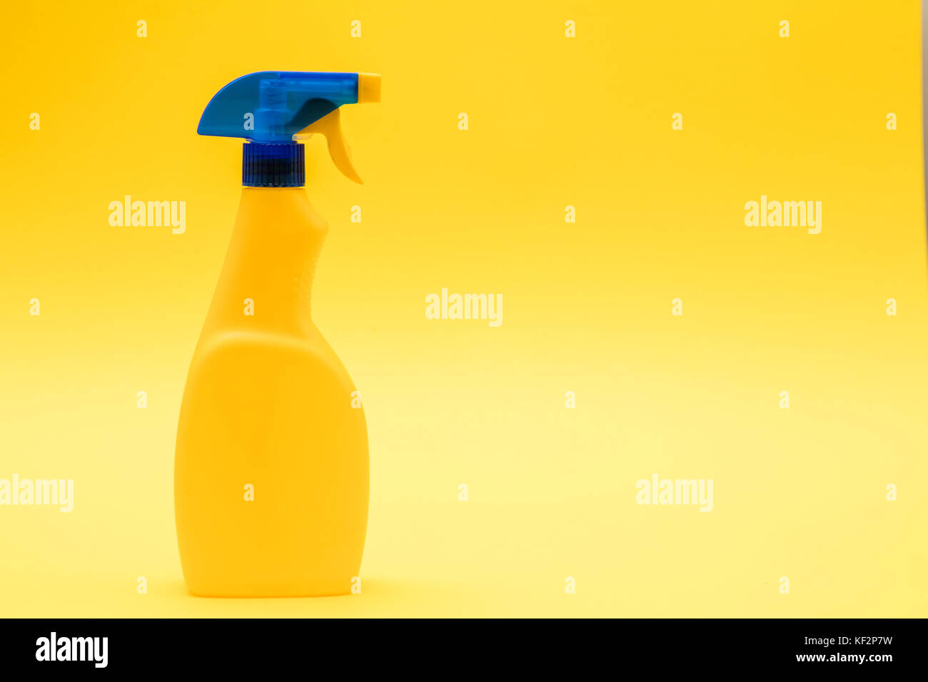 Cleaning spray bottle products on a bright yellow background Stock ...