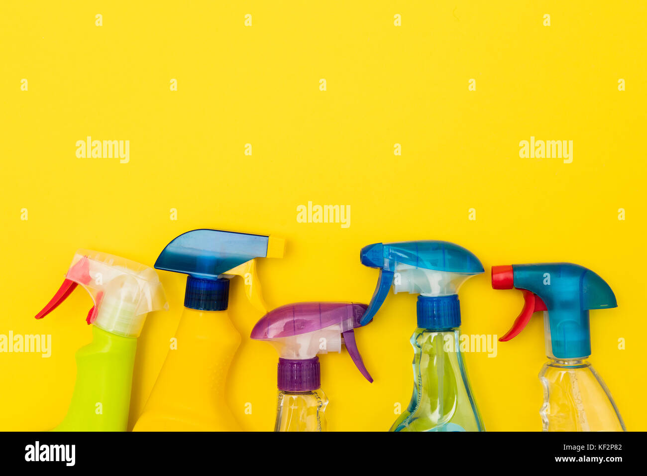 Cleaning spray bottle products on a bright yellow background Stock ...