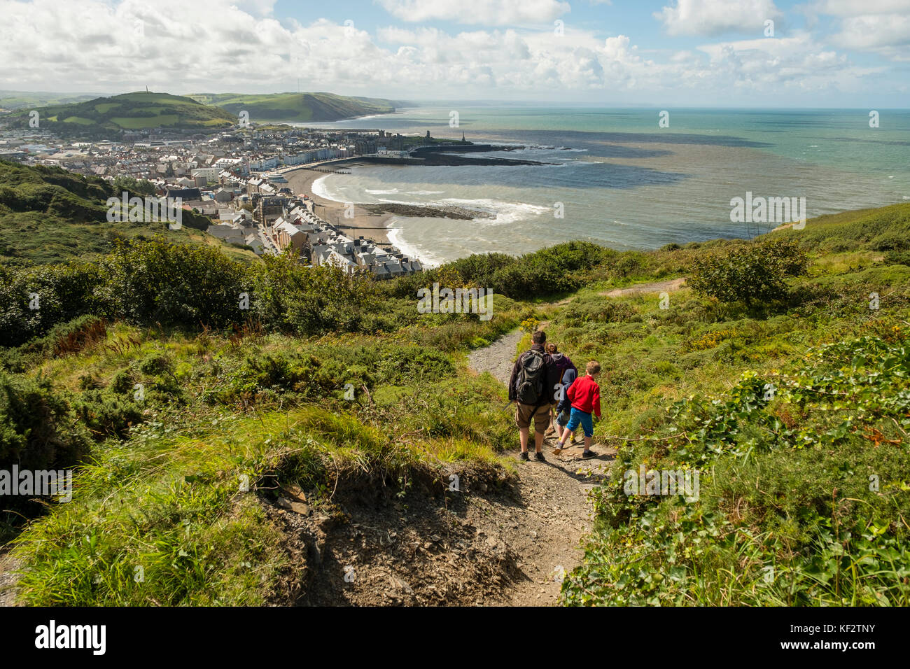 A family walking down Constitution Hill, Aberystwyth , Ceredigion ...