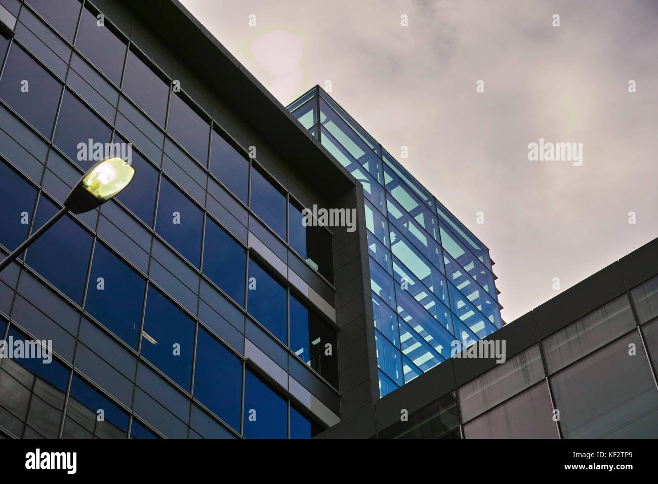 Looking up at dark gloomy office buildings. Tall menacing commercial ...