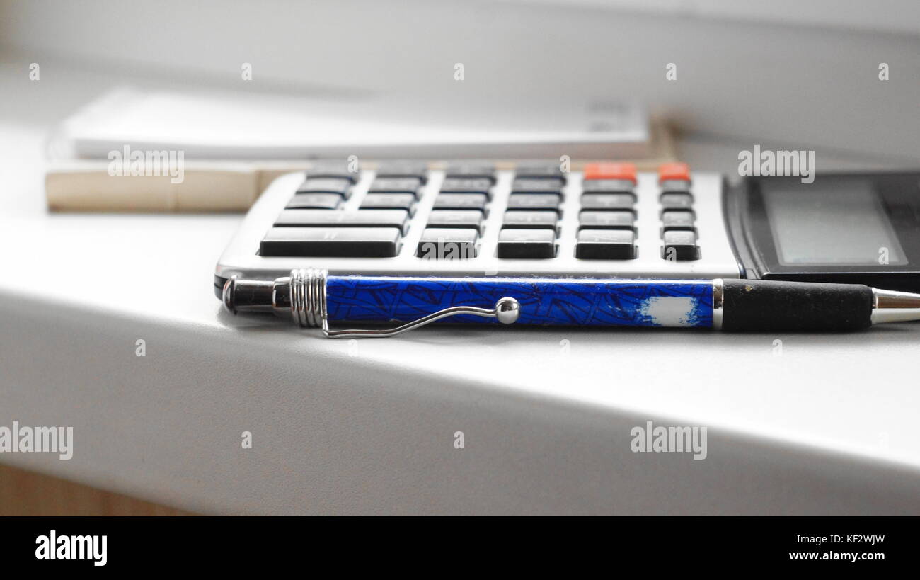 Calculator, pen and paper notepad Counting on the calculator and record ...