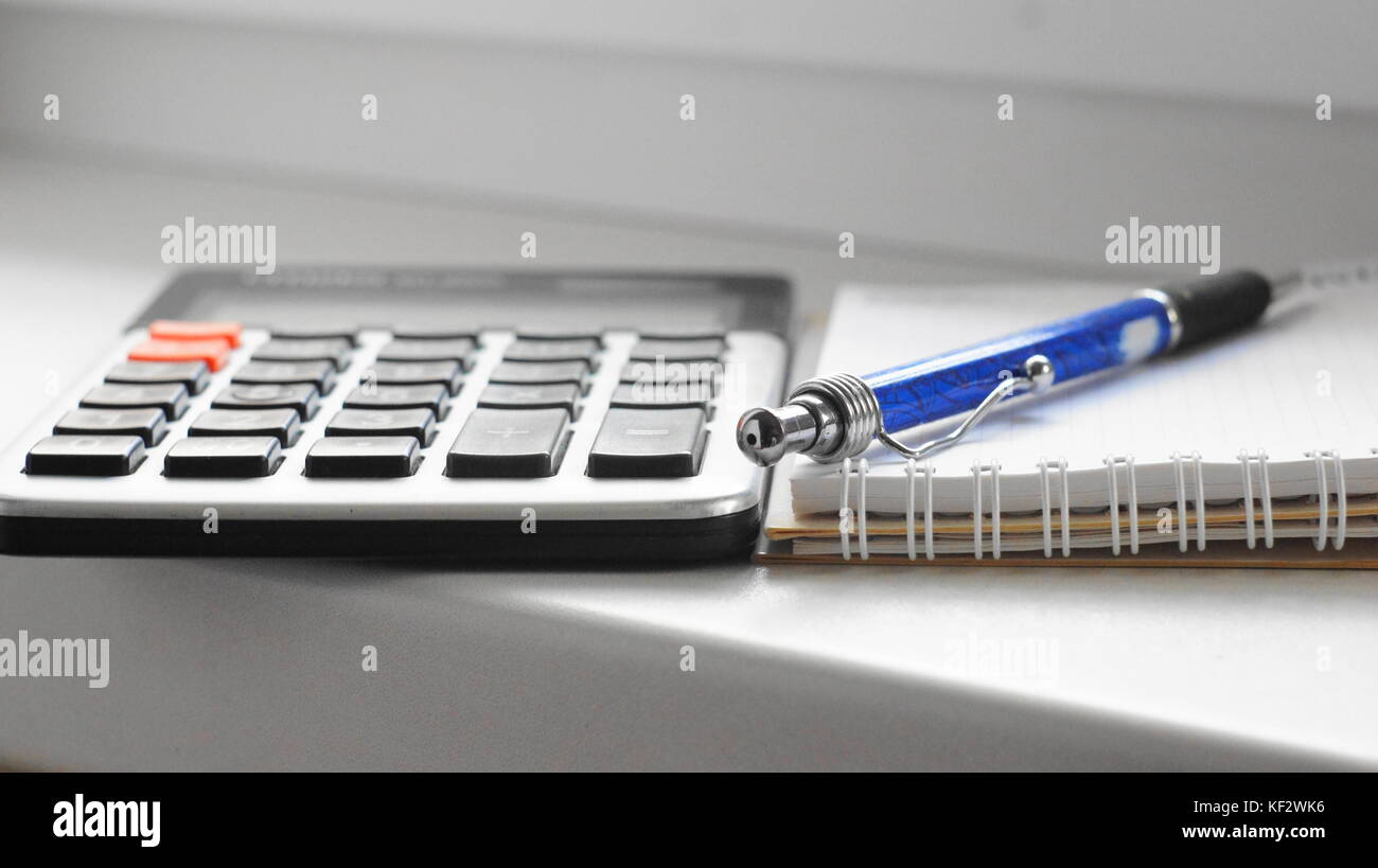 Calculator, pen and paper notepad Counting on the calculator and record ...