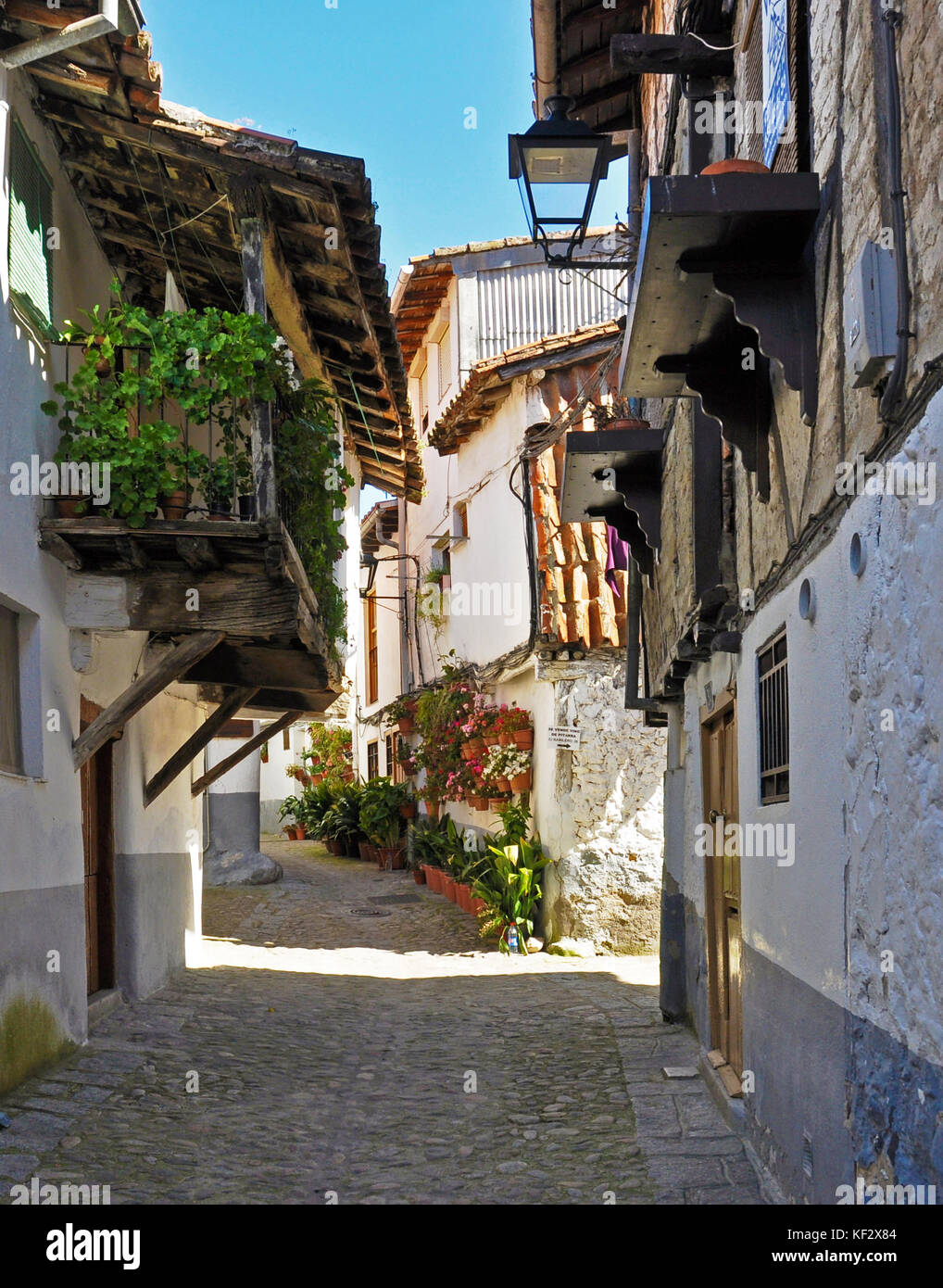 A cozy narrow street in a Spanish town Stock Photo - Alamy