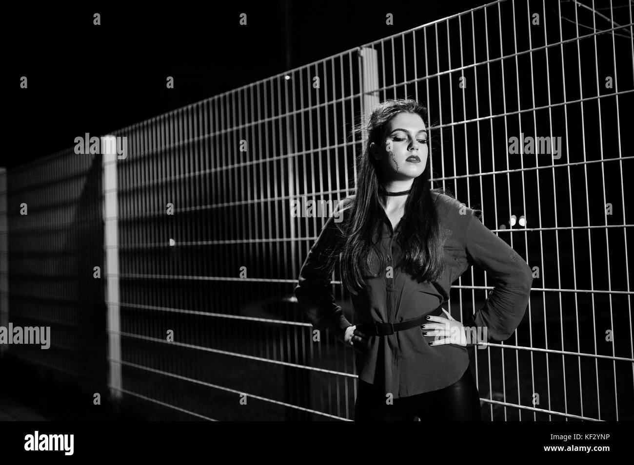 Black girl in red shirt and bright make-up on night street outdoor ...
