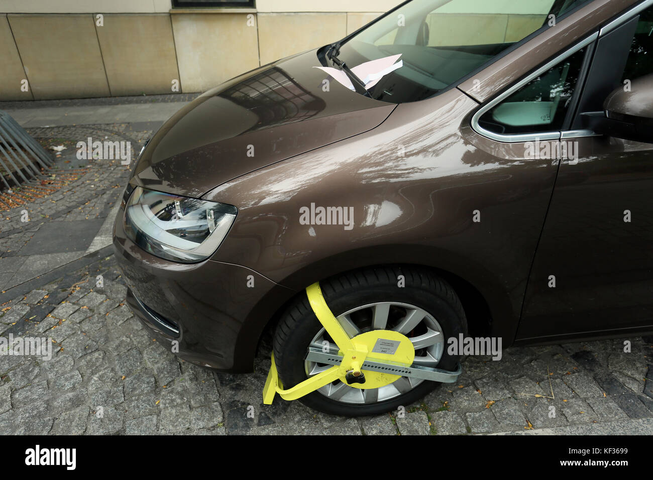 Car parking, wheel blocker, penalty, Krakow, Poland Stock Photo - Alamy