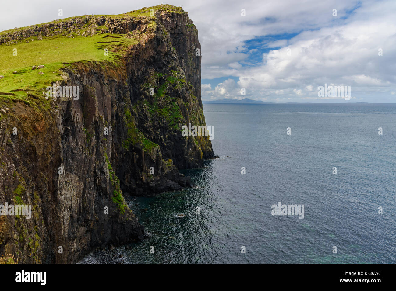 Cliffs of Neist Point, rugged and rocky coast on the Isle of Skye, in ...