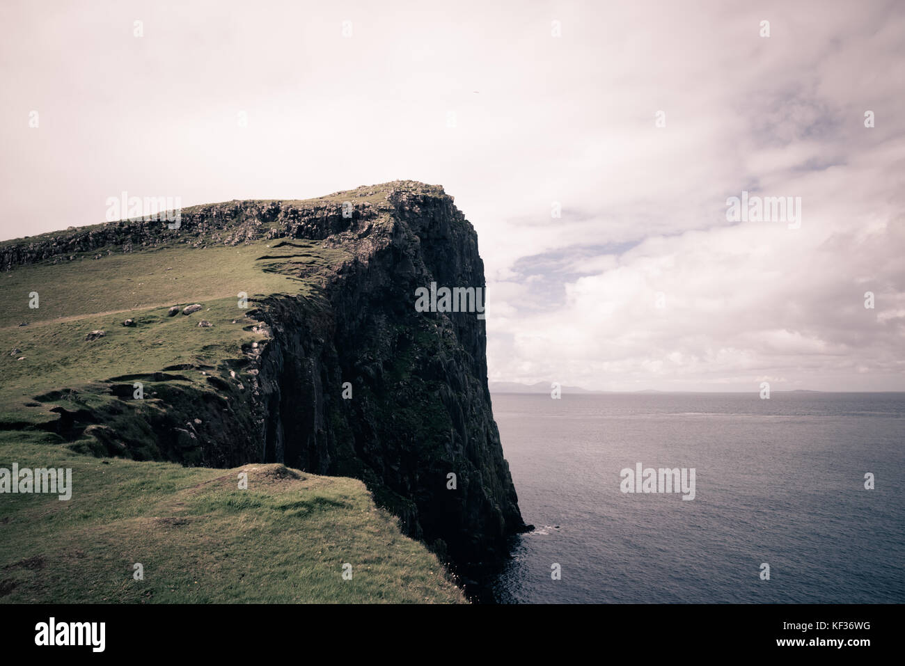 Cliffs of Neist Point, rugged and rocky coast on the Isle of Skye, in ...
