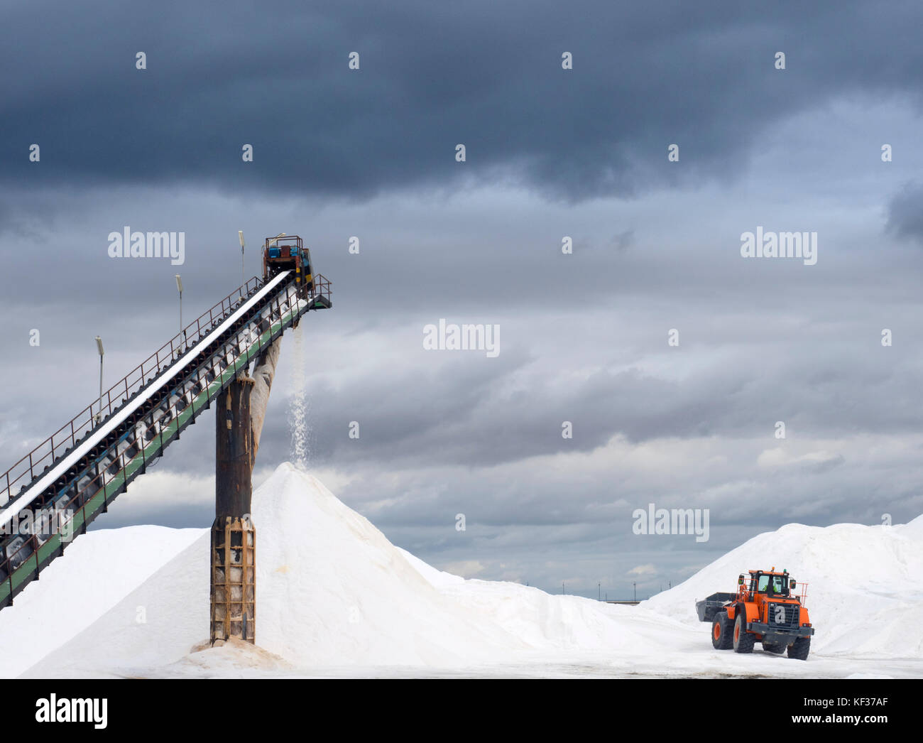 Salt being processed and broken down by machinery in Spain Stock Photo ...