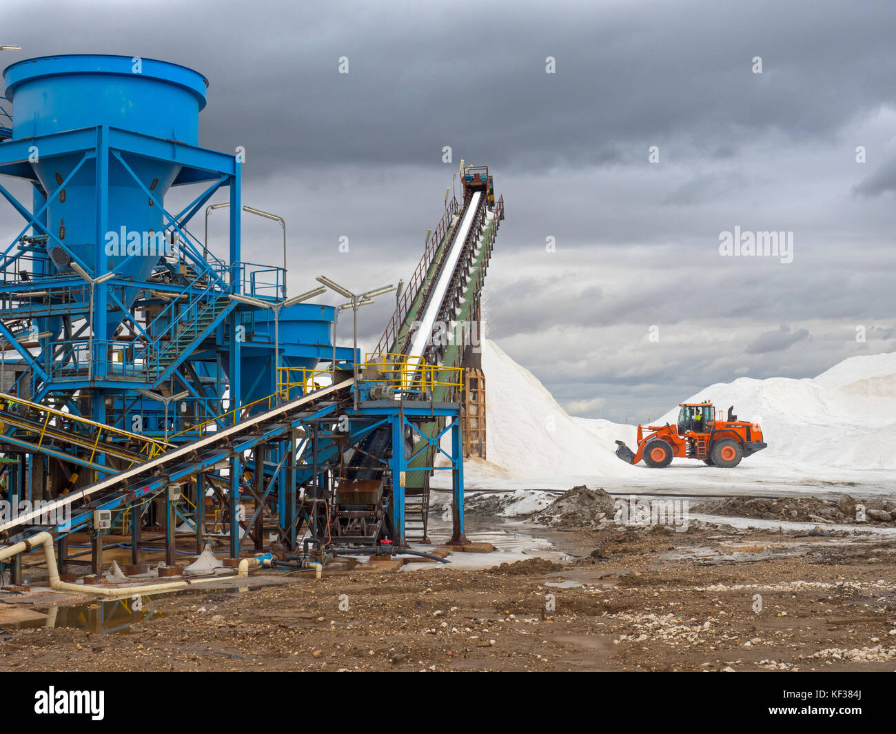 Salt being processed and broken down by machinery in Spain Stock Photo ...